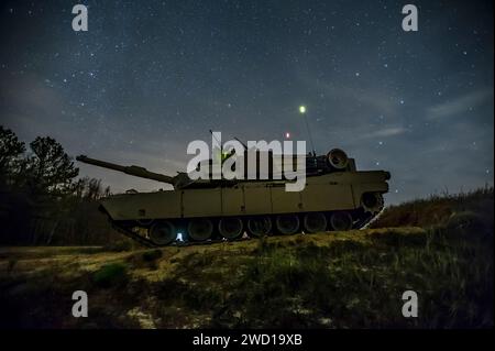 An M1A2 SEP Abrams tank sits ready to fire at night, Fort Stewart ...
