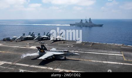 USS George H.W. Bush sails in formation with USS Philippine Sea, USS ...
