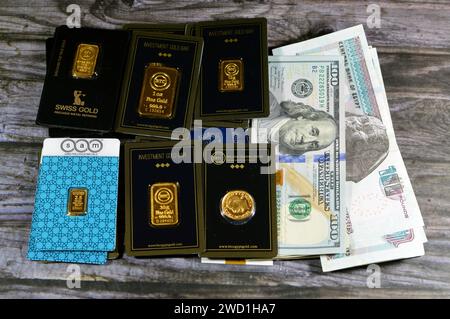 Cairo, Egypt, January 15 2024: Egyptian pounds money and pile of 24K ...