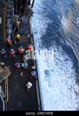 Civil service mariners aboard the USNS Spearhead participate in a fire ...