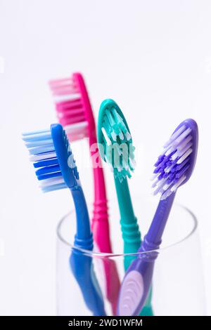 Four colourful plastic toothbrushes Stock Photo - Alamy