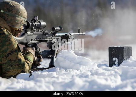 A U.S. Marine fires an M240B machine gun during Artillery Relocation ...