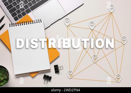 Distribution. Laptop and different stationery on wooden desk, flat lay ...