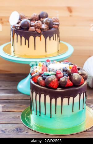 Two brown and pink cakes isolated on white background Stock Photo - Alamy