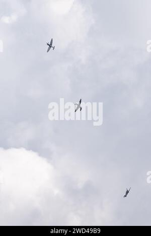 Spitfire formation dogfight in the clouds at flying legends airshow in ...