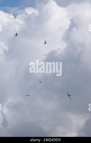 Spitfire formation dogfight in the clouds at flying legends airshow in ...