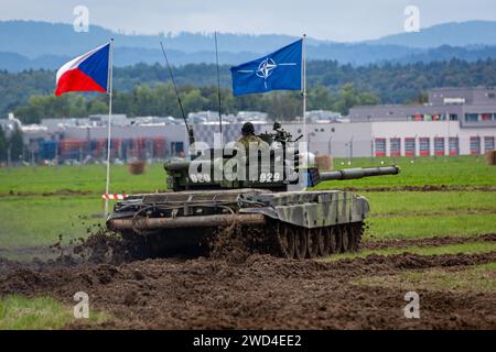 T72 Tank (M4 CZ Variant number 029) driving on a muddy field in front ...