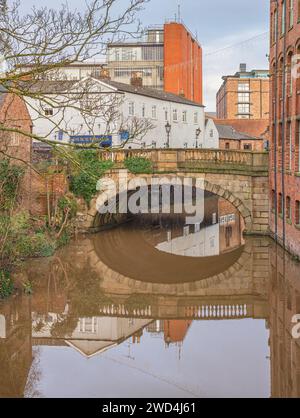 Old Ivy Bridge reflected in Avon Prysor river in Ceunant Llennyrch ...