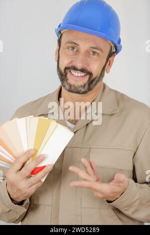 man builder holding a color swatch Stock Photo - Alamy