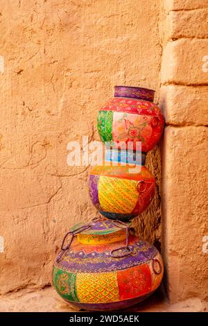 Three ornated traditional decorated arabic jars standing on street of ...
