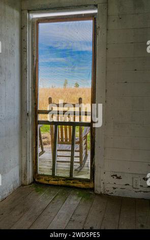 Screen Back Door to Rocking Chair on Porch Stock Photo - Alamy