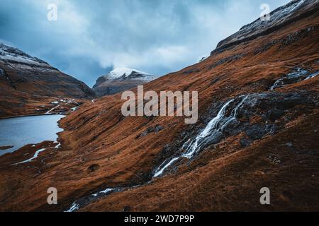 A dramatic waterfall cascades down the north coast of Tanaga Island in ...