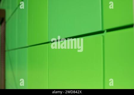 Green metal wall. Square wall slabs. Exterior of building. Green design ...