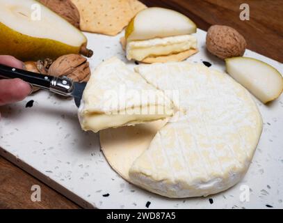 French soft Cremeux de Normandie cheese, soft creamy cheese with white ...