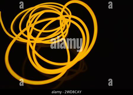 The original yellow lighting of thick electoluminescent wires and lines ...