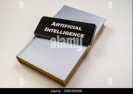 Book and device with text Artificial Intelligence. Learning, use, tools and data processing of ...