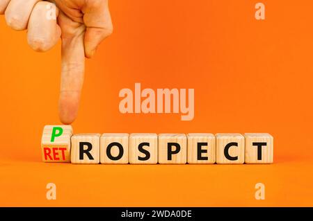 Perspective or retrospective symbol. Businessman hand turns cubes and ...