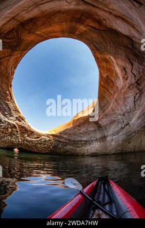 Kayaking inside Double-O arch, Lake Powell, Utah Stock Photo - Alamy