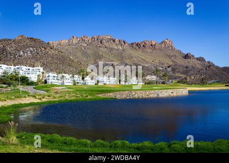 Aguilon Golf, golf course with palm trees and lake in front of the ...