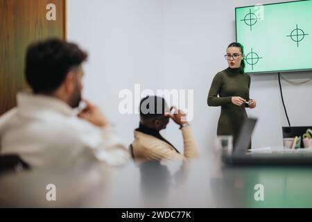 Multi generational colleagues collaborating in an evening business ...