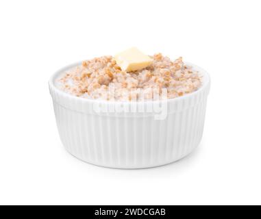 Tasty wheat porridge with milk and butter in bowl isolated on white ...