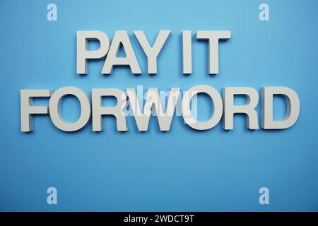 Pay it Forward word alphabet letters on wooden background Stock Photo ...