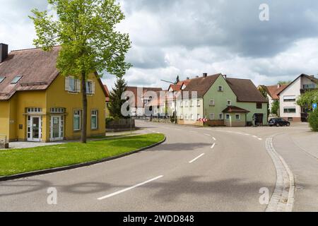 Weinberg, Germany - May 6, 2023: Houses along the road, cars in a ...