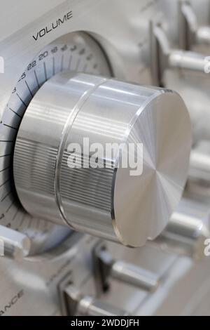 Old vintage stereo amplifier, aluminium front panel with knobs, buttons ...