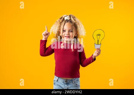 Idea Illumination. Child girl Genius with Paper Bulb.Success ...