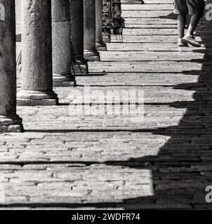 Beautiful street with arcades and pillars in the old town of Ribadeo ...