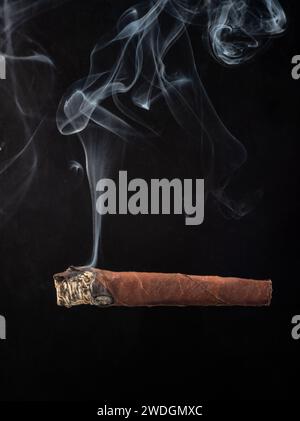 Burning cuban cigar isolated on a white background Stock Photo - Alamy