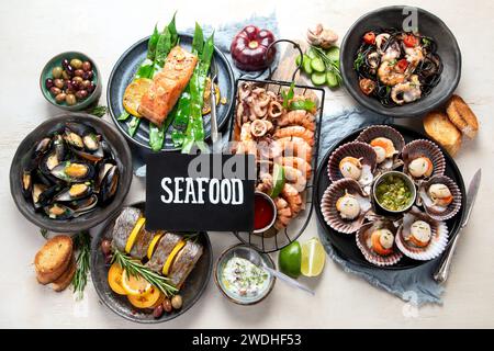 Various seafood and fishes dishes. Healthy food concept on blue ...