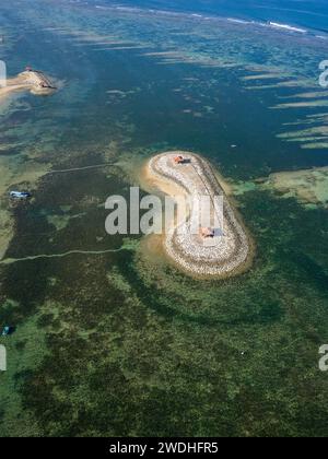 Aerial view of an offshore gazebo protected by a huge, fringing ...