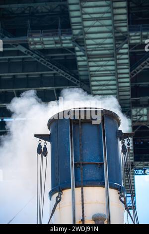Steam pours from the funnel of the historic 1902 steam tug Waratah ...