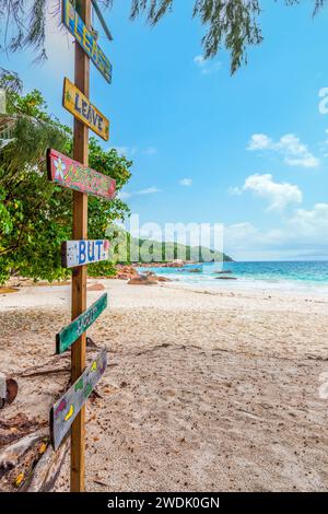 Please leave nothing but your footprints, sign at Anse Lazio beach ...