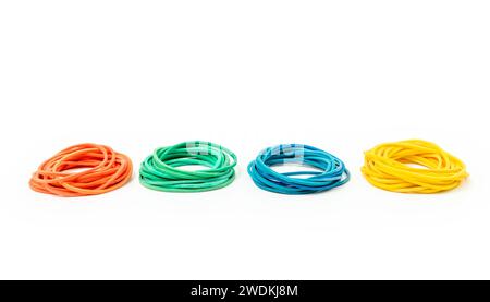 Stacks of different rubber bands on white background Stock Photo - Alamy