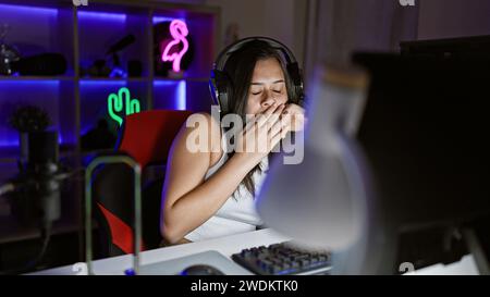 Young beautiful hispanic woman streamer playing video game using ...