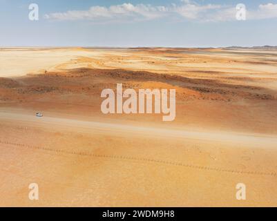 Aerial view of a Four-wheels Drive on C35 desert track around the ...