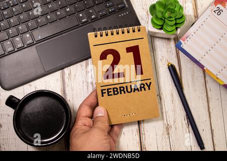 21 Februar on wooden grey cubes. Calendar cube date 21 February ...