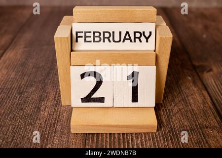 21 Februar on wooden grey cubes. Calendar cube date 21 February ...