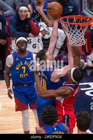 Denver Nuggets guard Christian Braun, front left, dunks the ball for a ...