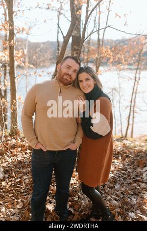 Happy couple getting engaged on the sofa Stock Photo - Alamy