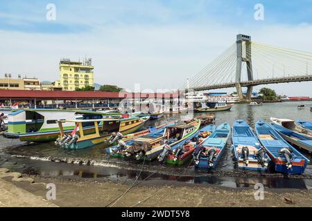 Boats in Manado port and Soekarno Bridge in provincial capital of ...