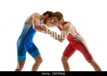 Young skilled wrestlers in blue and red uniform hand wrestling in ...