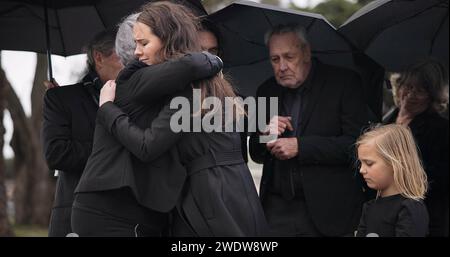 Funeral, crying family and child hug grandmother for support, mourning ...