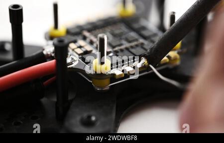 Process of soldering connections on microchip of fpv drone Stock Photo ...