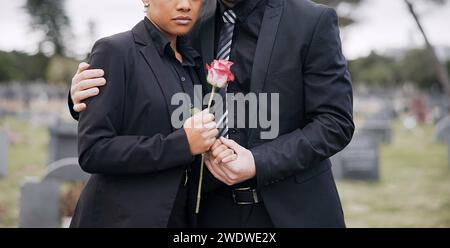 Couple, sad and mourning at tomb of graveyard, funeral and pay respect ...