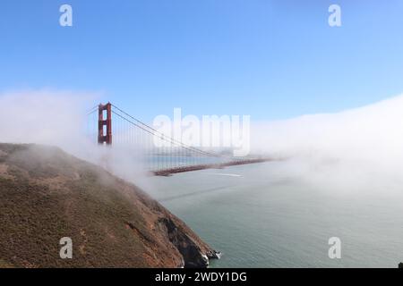 Golden Gate bridge covered in the fog at daytime in San Francisco ...