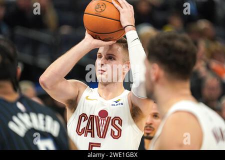 Cleveland Cavaliers' Sam Merrill (5) shoots over Milwaukee Bucks' AJ ...