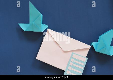 Two birds paper origami carrying letter envelope with warning sign ...